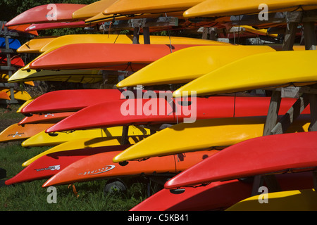 Storage of red kayaks and boats in hangar Stock Photo - Alamy