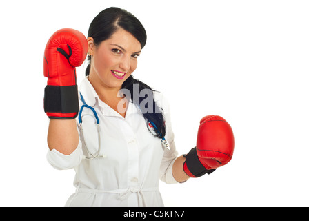 Female doctor wearing red boxing gloves celebrating with arms raised ...