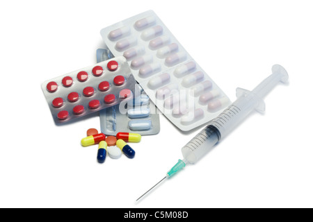 Colorful pills, blister and syringe on a black background Stock Photo ...