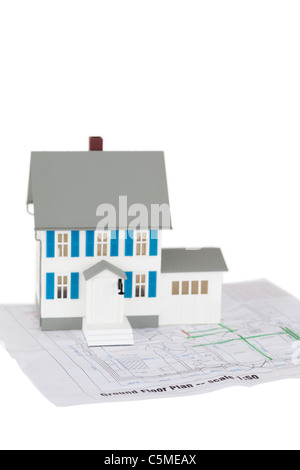 Toy house model on a ground floor plan Stock Photo - Alamy