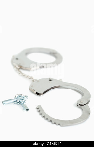 handcuffs and keys Stock Photo - Alamy