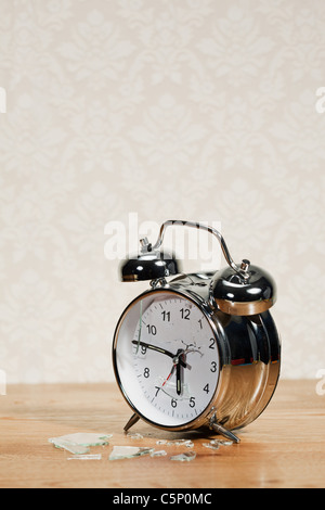Smashed alarm clock Stock Photo - Alamy