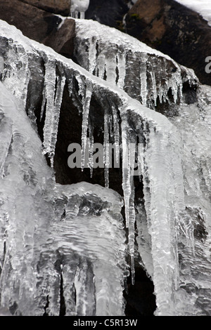Vertical shot of Icicles hanging off of a building Stock Photo - Alamy