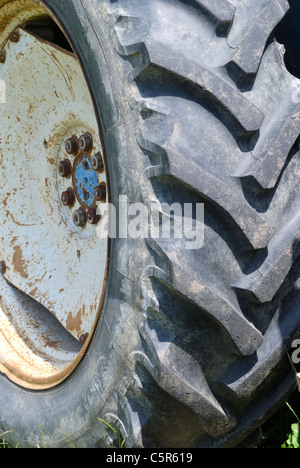 Old tractor tire with rusty wheel with corrosion Stock Photo - Alamy