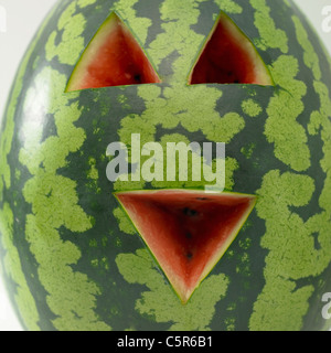 A watermelon carved like smiling face Stock Photo - Alamy