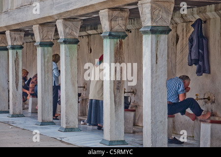 muslim men washing their feet before entering the Blue mosque for ...