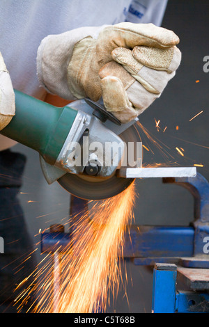 Man working with grinder saw, close up view on tool. Electric saw and ...