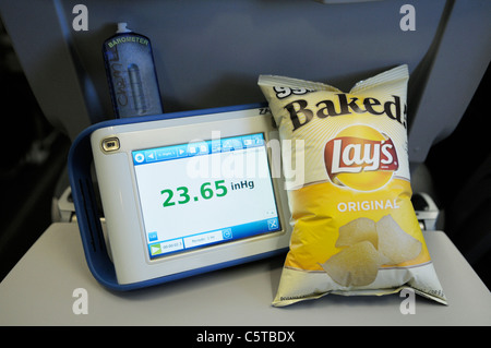 Chip bag puffed up because of lower atmospheric pressure at high ...