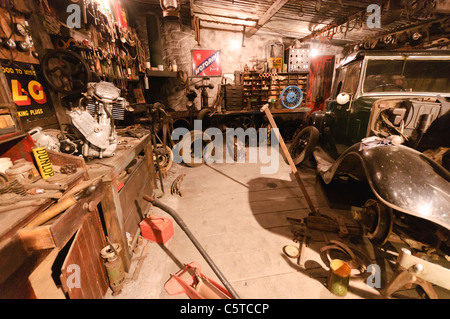 An Old fashioned mechanics workshop garage full of vintage parts for ...