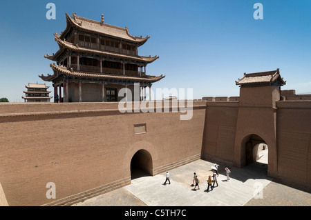Rammed earth walls tower above courtyard at Jiayuguan Fort, part of ...