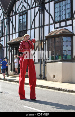 person man walking on stilts in street road in city town Stock Photo ...