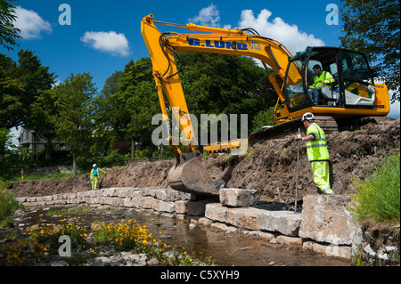 Improving river bank on stream to help prevent flooding Stock Photo - Alamy