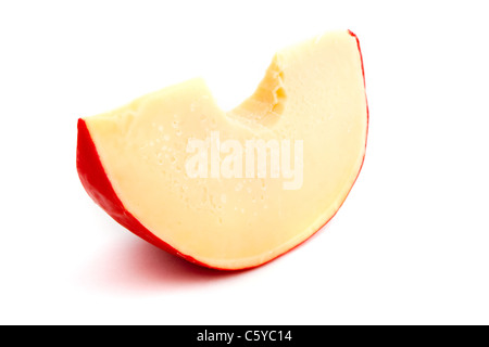 Edam cheese slice with a missing bite isolated on white Stock Photo - Alamy