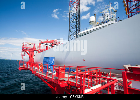Wind turbine blades on a jack up barge constructing the Walney offshore ...