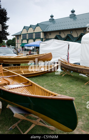 New York, Clayton. Antique Boat Museum.16 foot vintage Peterborough "all wood" canoe with wicker ...
