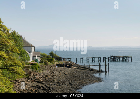 Old wooden pier at Aberdour, Fife. The Pentland hills are visible ...