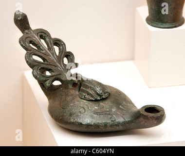 Ancient roman bronze oil lamp in the shape of human head Stock Photo ...