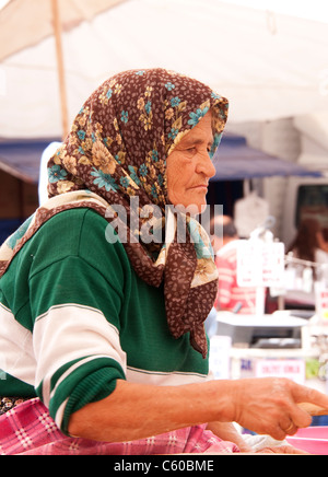 Elderly woman making Gözleme, a traditional Turkish food, Kalkan ...