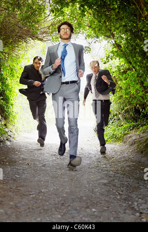 back view of running business man Stock Photo - Alamy