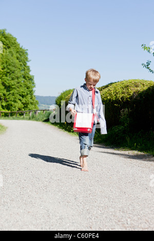 Children walking barefoot on rural road Stock Photo - Alamy
