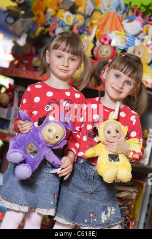 Two kids buying toys in toy store Stock Photo - Alamy