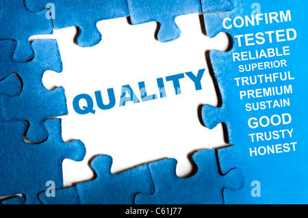 Puzzle pieces with word quality control Stock Photo - Alamy