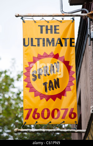 An advert for spray tanning in Preston, Lancashire, UK Stock Photo - Alamy