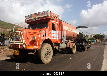 Vintage Tata 1210 SE water bowser supplying local water filling up its ...