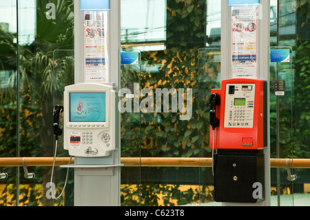 Public payphones in the landside departure hall, Changi Airport ...