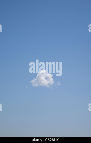 A single cloud floating in a blue sky Stock Photo - Alamy