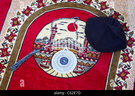 muslim prayer mat with compass Stock Photo - Alamy