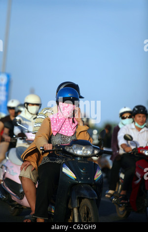 Woman talking on smartphone while driving modern car, view from outside ...