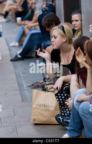 Primark shoppers gather outside the Oxford Street store in London ...