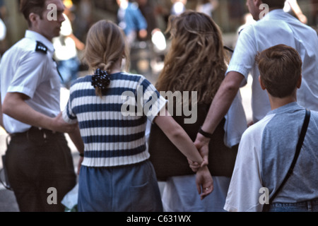Children being taken into custody by police Stock Photo - Alamy