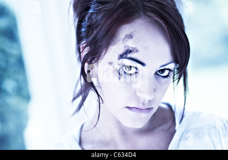 Home violence. Beaten woman with injuries on face, bleeding, black eye ...