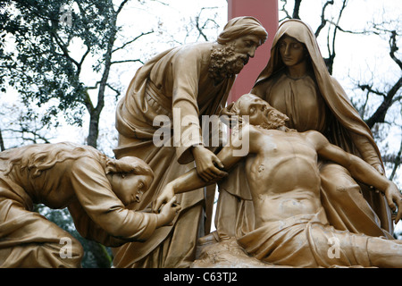 Lourdes in winter: Jesus Christ with the cross, Roman soldiers and the ...