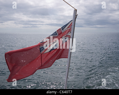 The red duster or red ensign flag of the merchant navy or british fleet ...