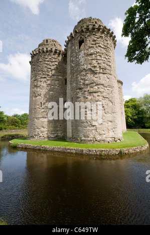 The ruins of Nunney Castle, built in the 1370s, and Nunney Brook near ...