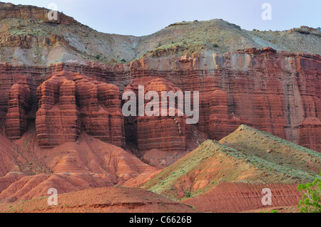 Multicolored sedimentary rock layers are evident in the colorful cliffs ...