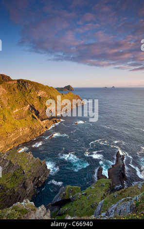 The distant Skellig Islands viewed from cliffs near the village of ...