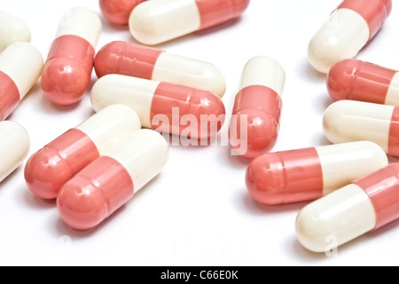 pink capsules isolated on white background, copyspace for text ...