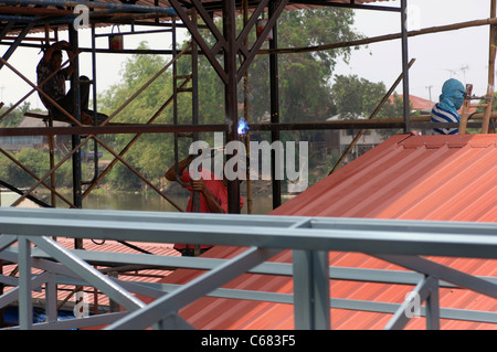 Workman soldering, Ayutthaya Thailand Stock Photo - Alamy