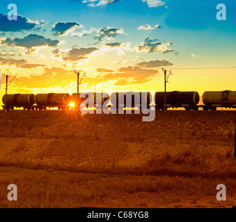 Fuel freight train passing the steel bridge over the river Stock Photo ...