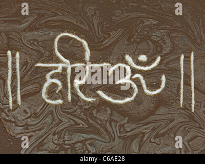 A holy sign or letter called ' Hari Om ' is made by Rangoli Stock Photo ...