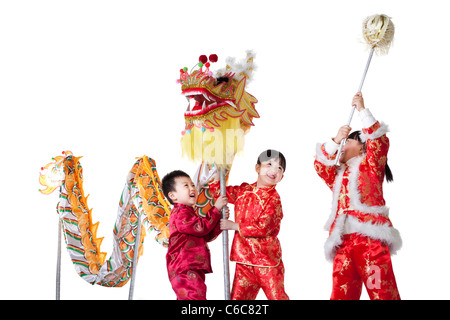 Three Chinese children holding Chinese dragon Stock Photo - Alamy