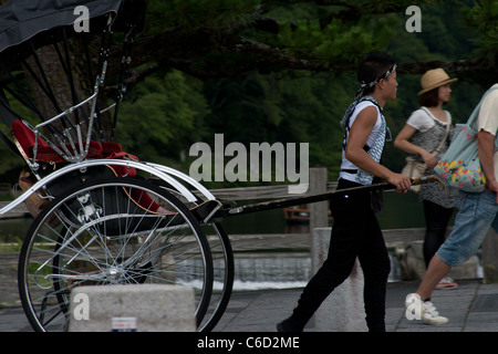 Traditional rickshaw carriage seat and wheels in Miyajima island, Japan ...