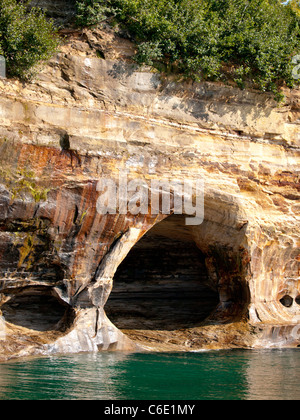 Michigan's Pictured Rocks beautifully colored cliffs has many caves ...