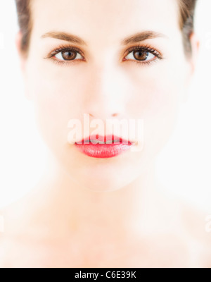 Portrait of a young woman with red lips straining her brains Stock ...