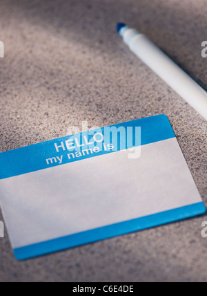 Name tag and a pen Stock Photo - Alamy