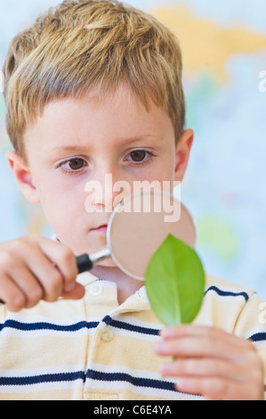 Close-up of boy looking through binoculars while sitting in car Stock ...